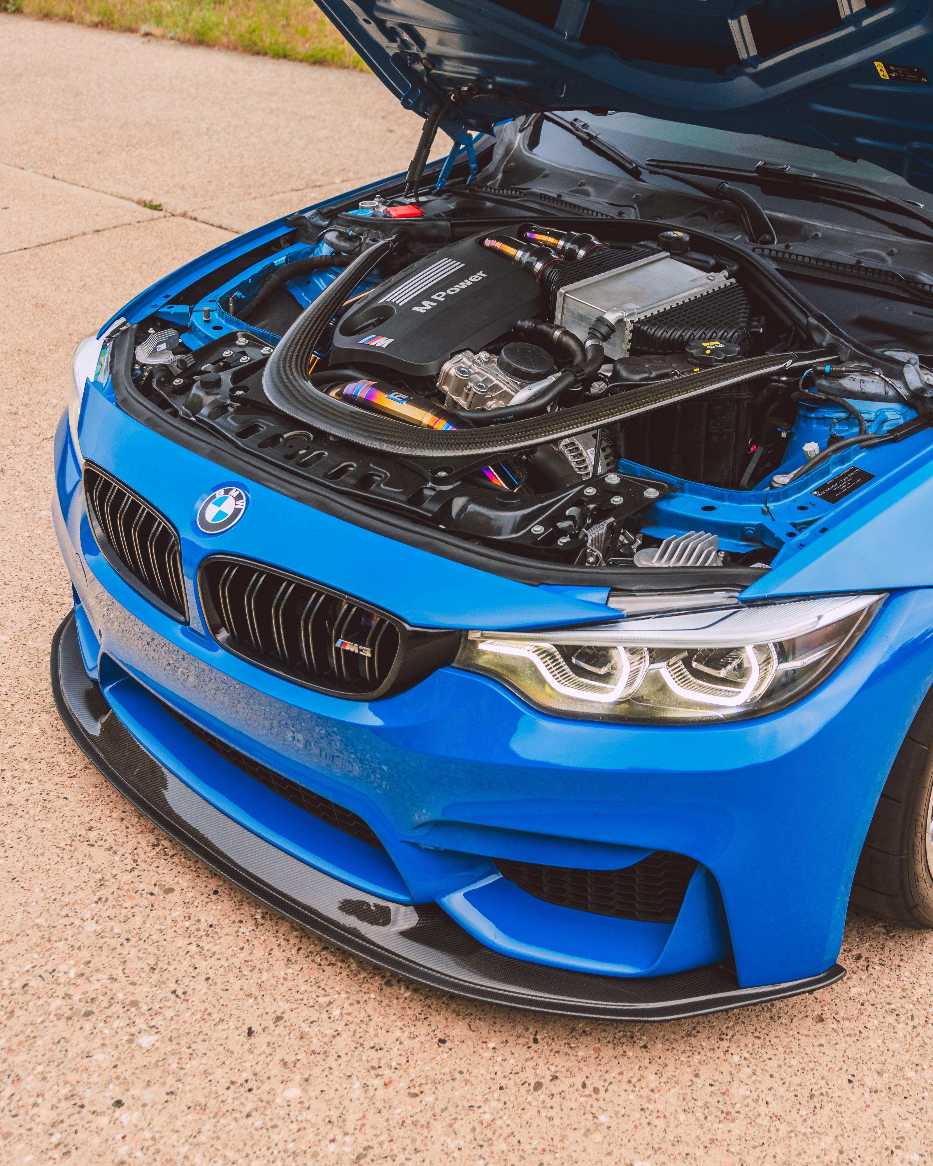 F8X M3/M4 J Style Carbon Fiber Front Lip – Aggressive Design with 2x2 Weave